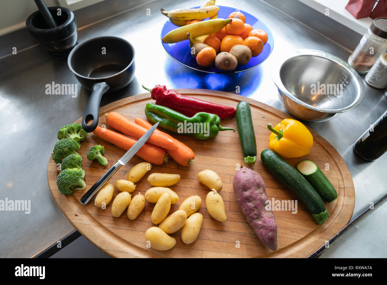 Vegetables on bench ready for preparation with knife Stock Photo - Alamy