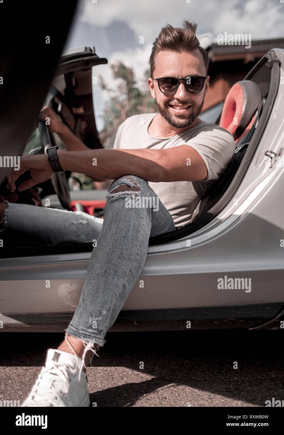 close up.successful young man sitting in a convertible car Stock Photo ...