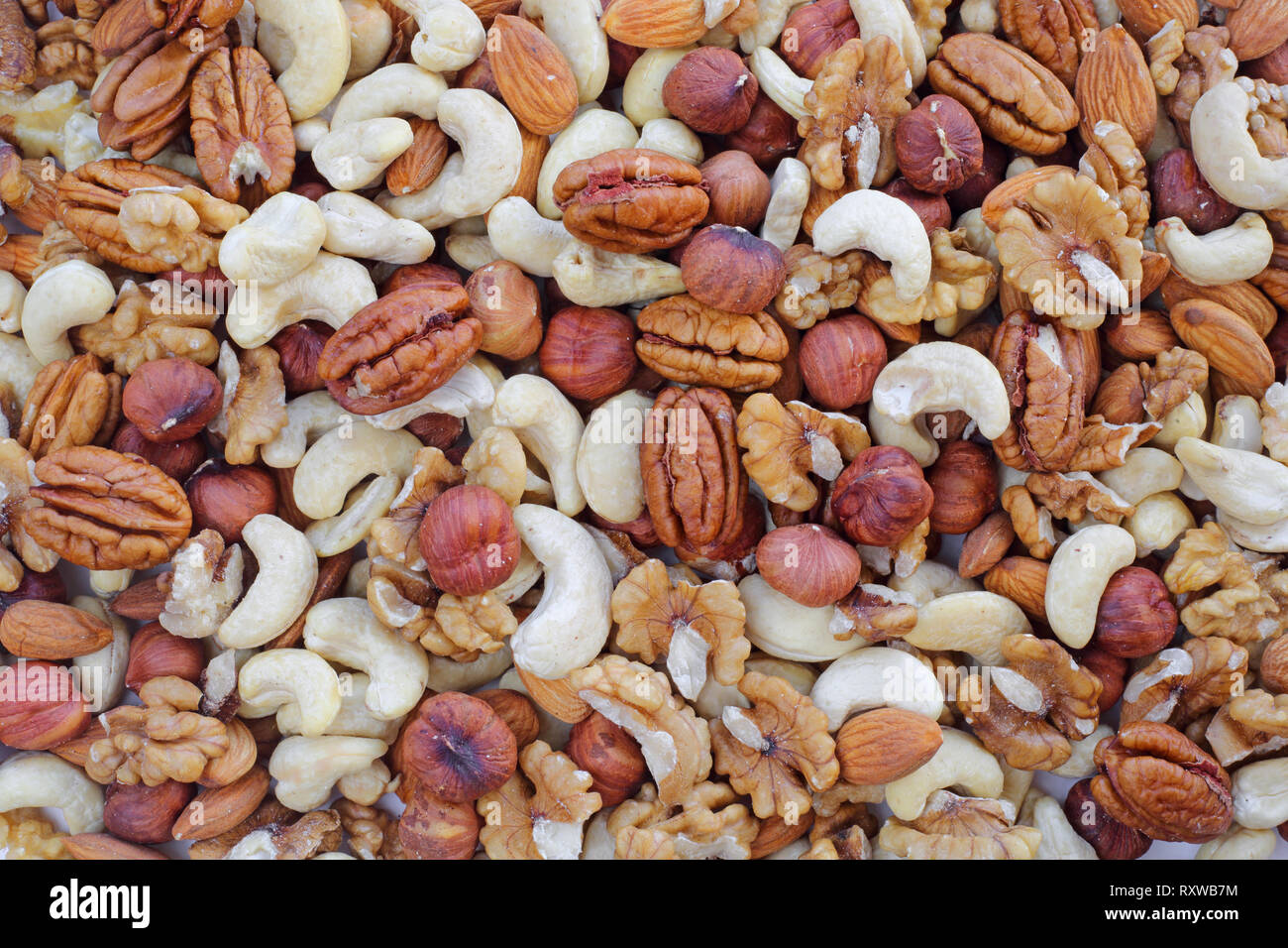 Natural background made from different kinds of nuts Stock Photo - Alamy
