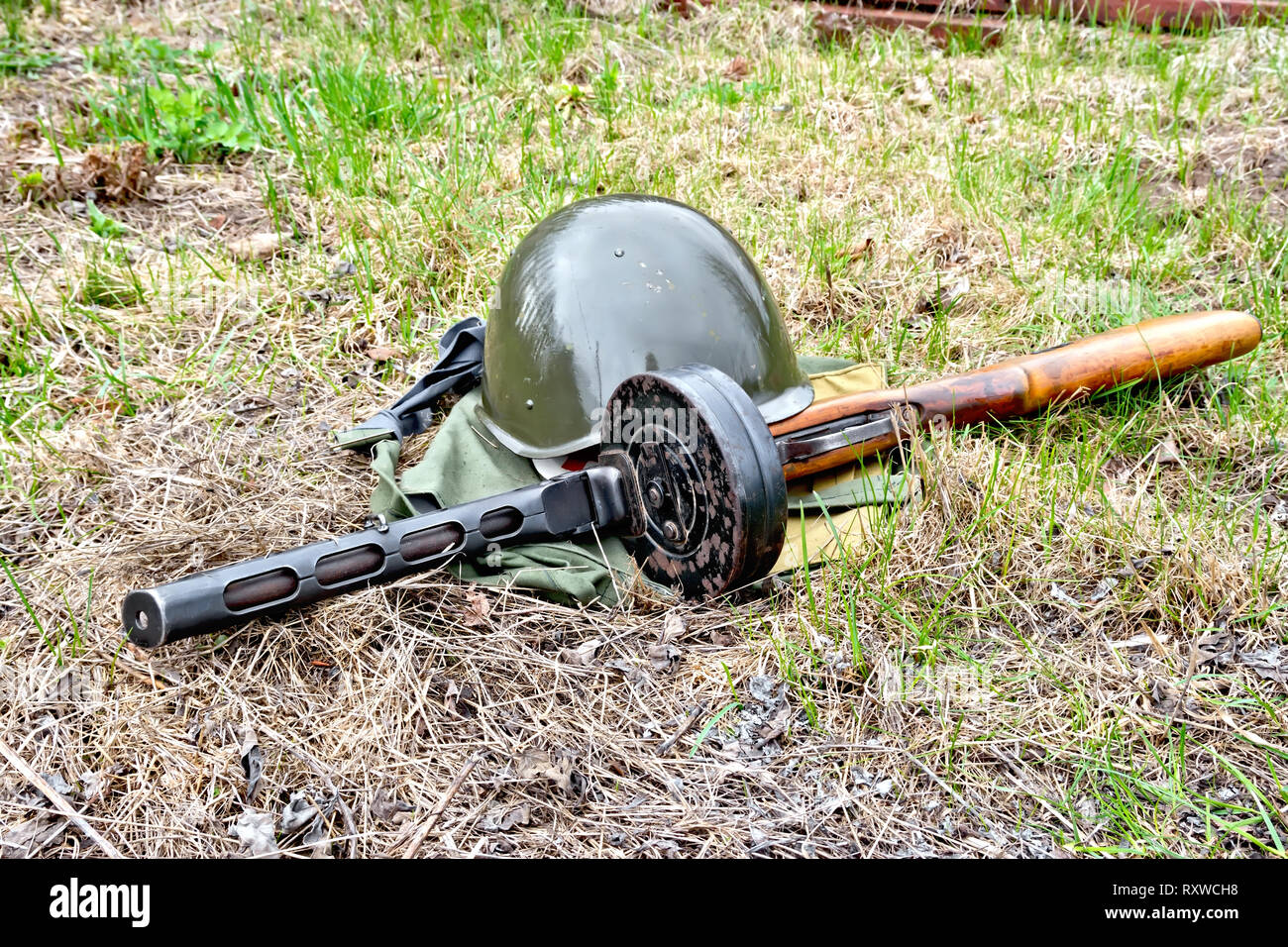 A helmet and a submachine gun of the times of the Great Patriotic War ...