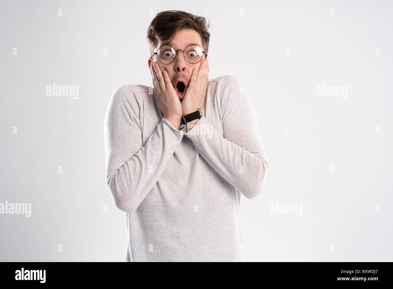 Man with shocked, amazed expression isolated on white background Stock ...