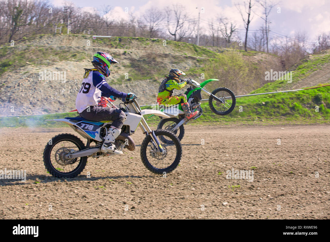 competition between two motocross bikes, side view Stock Photo - Alamy