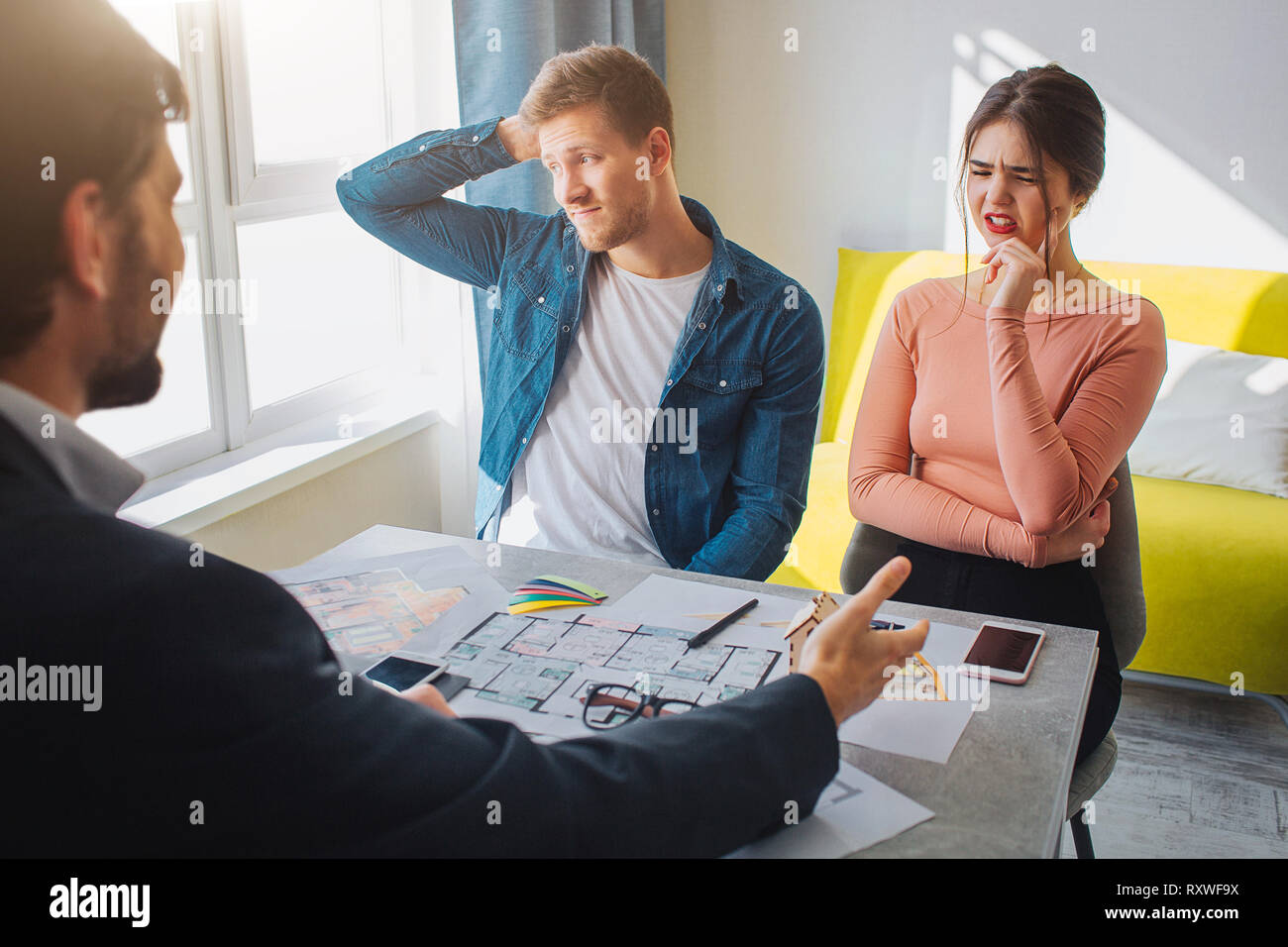 Couple buy or rent apartment together. Confused suspicious young man ...
