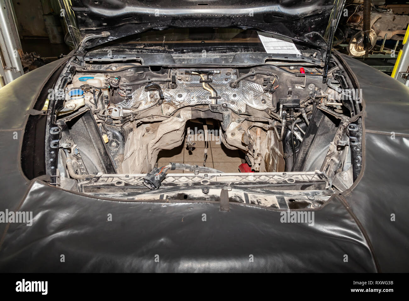 Car repair in the back of the suv with a view of the engine compartment ...