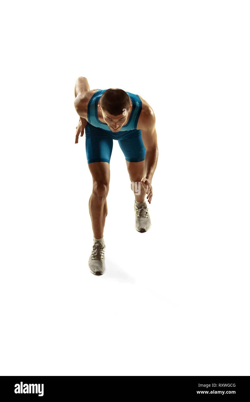 Young caucasian man running isolated on white studio background. One ...