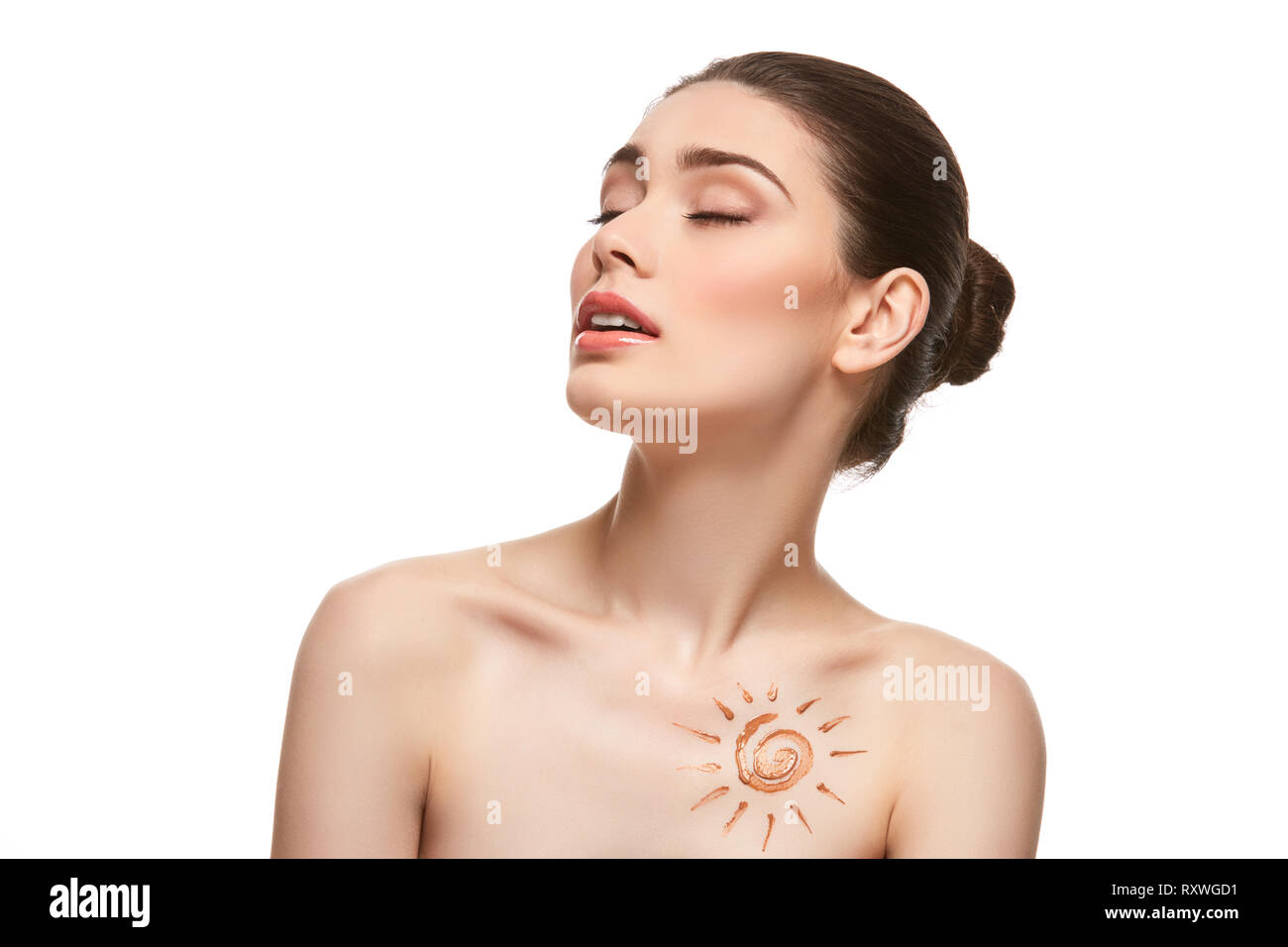 beautiful young woman with sun drawing. studio beauty shot on white ...