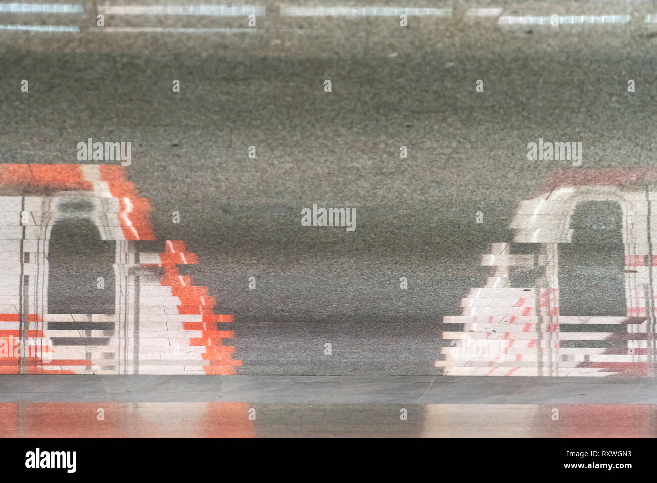 Reflections of a subway train on tile floor looks like puzzle Stock ...