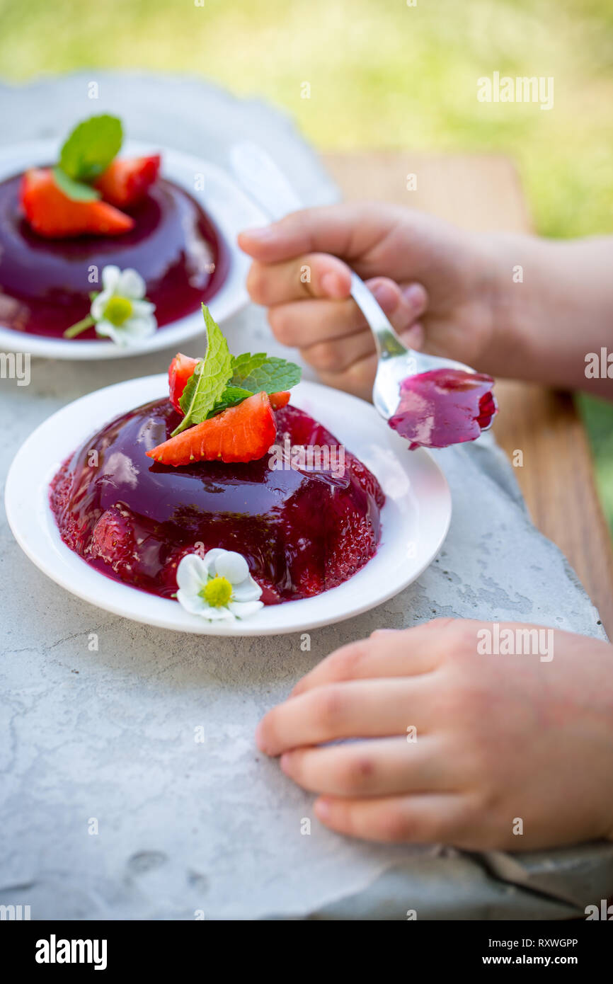 Child eating jelly Stock Photo - Alamy