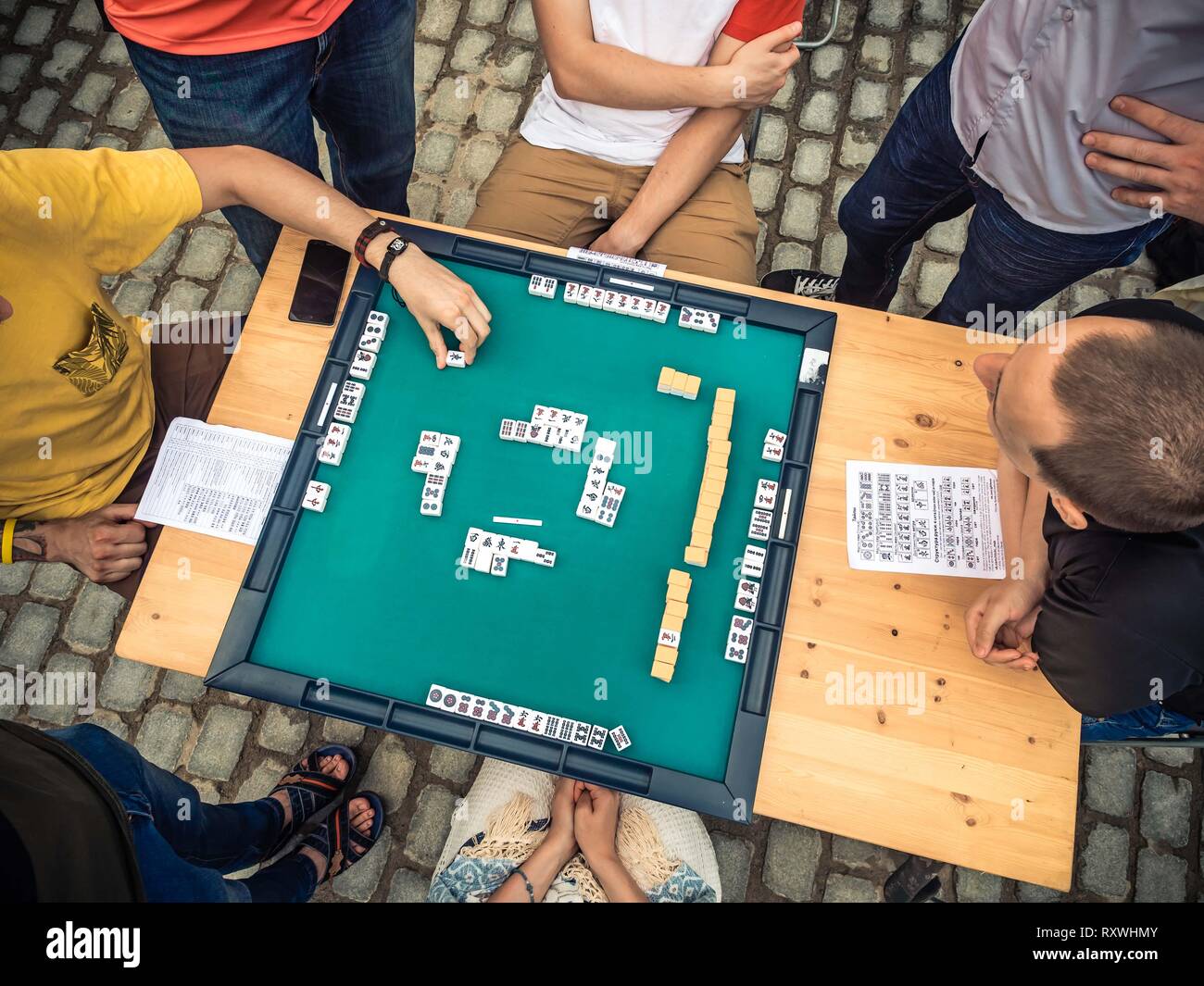 People Playing Mahjong Asian Tile-based Game. Table Gambling top view ...