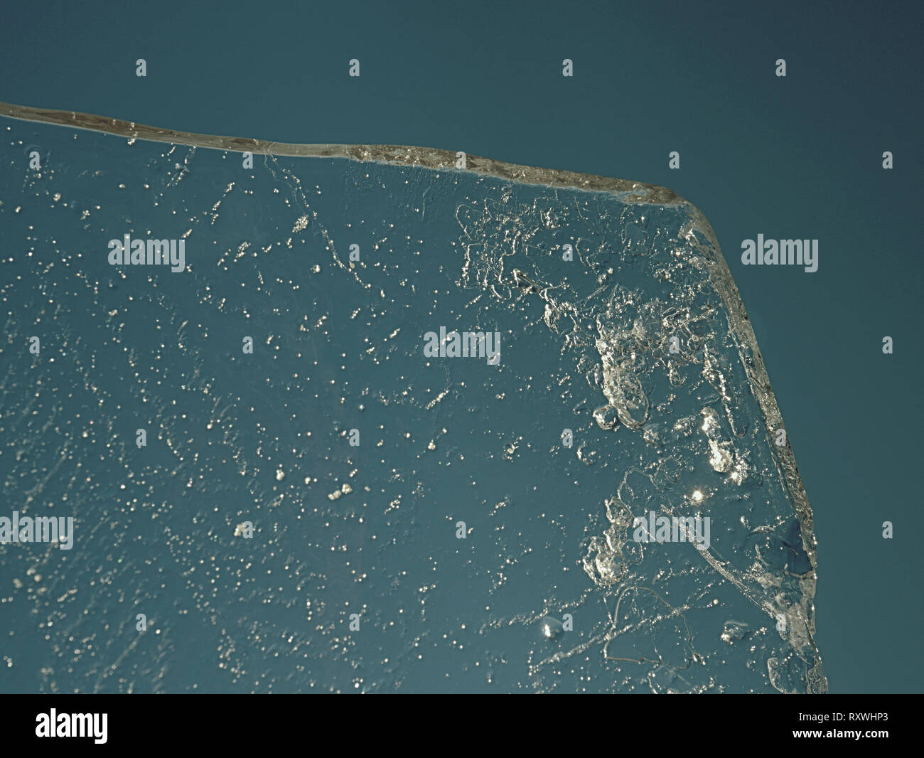 Flat ice plate or board against to blue sky. Abstract pure natural ...