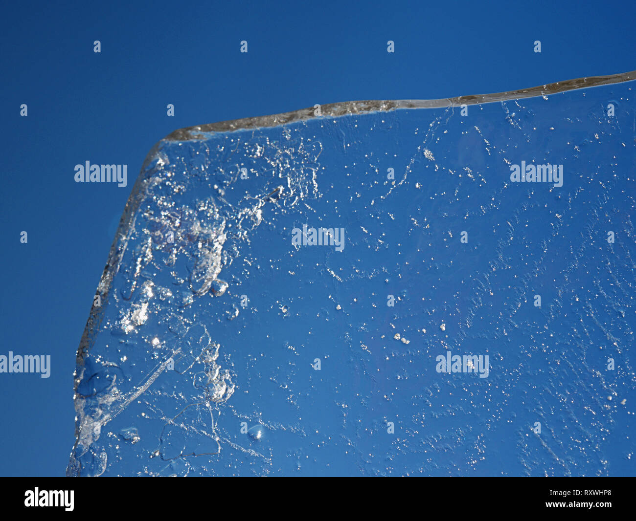 Ice board with cracks and bubbles. Natural flat ice piece Stock Photo ...