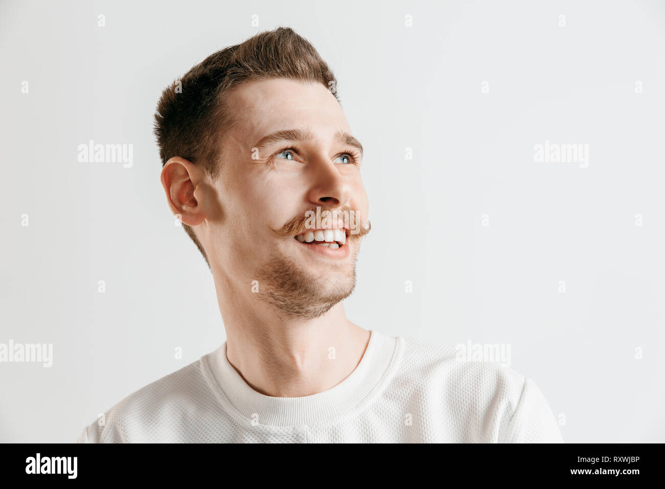 Happy business man standing, smiling isolated on gray studio background ...