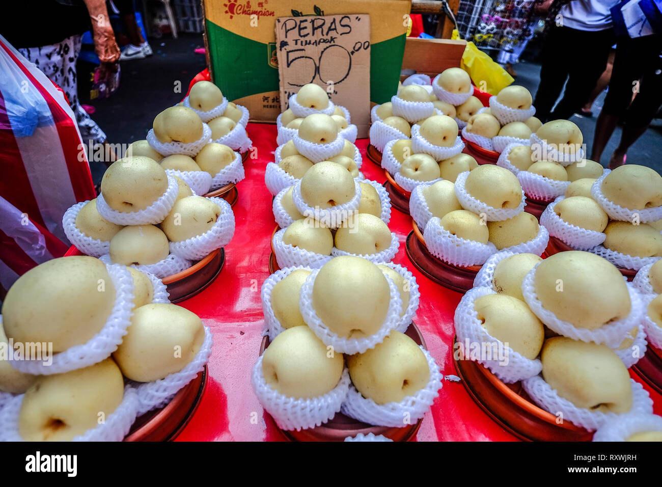 Manila, Philippines - Apr 12, 2017. Pile of yellow pears for sale at ...
