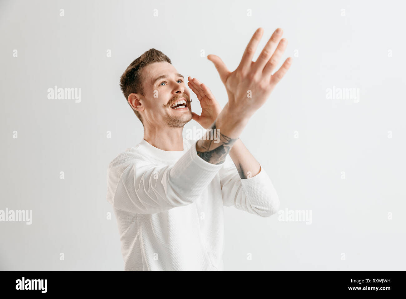 Happy business man standing, smiling isolated on gray studio background ...