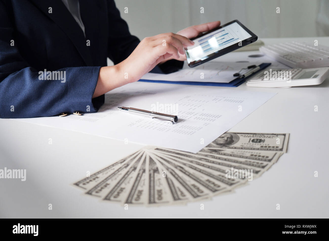 Women working in office. financial analysis with charts on pad for ...