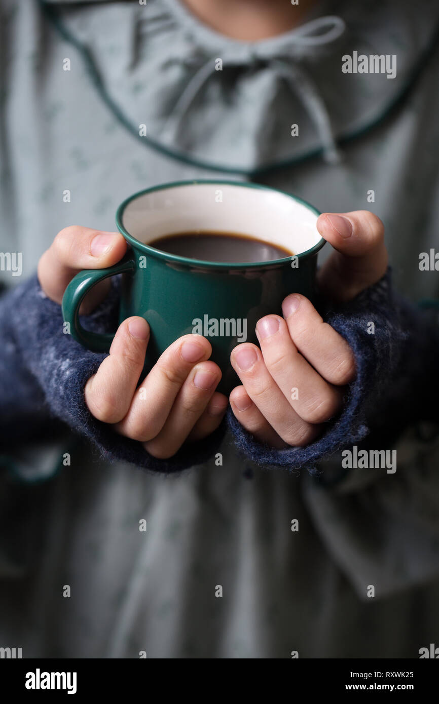 Cup in hand Stock Photo - Alamy