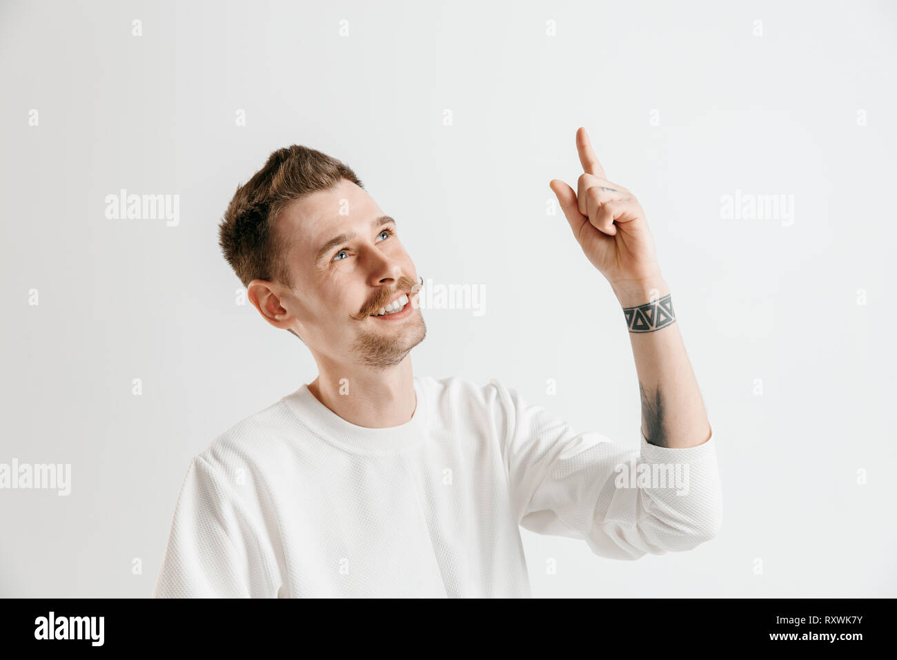 Happy business man standing, smiling isolated on gray studio background ...