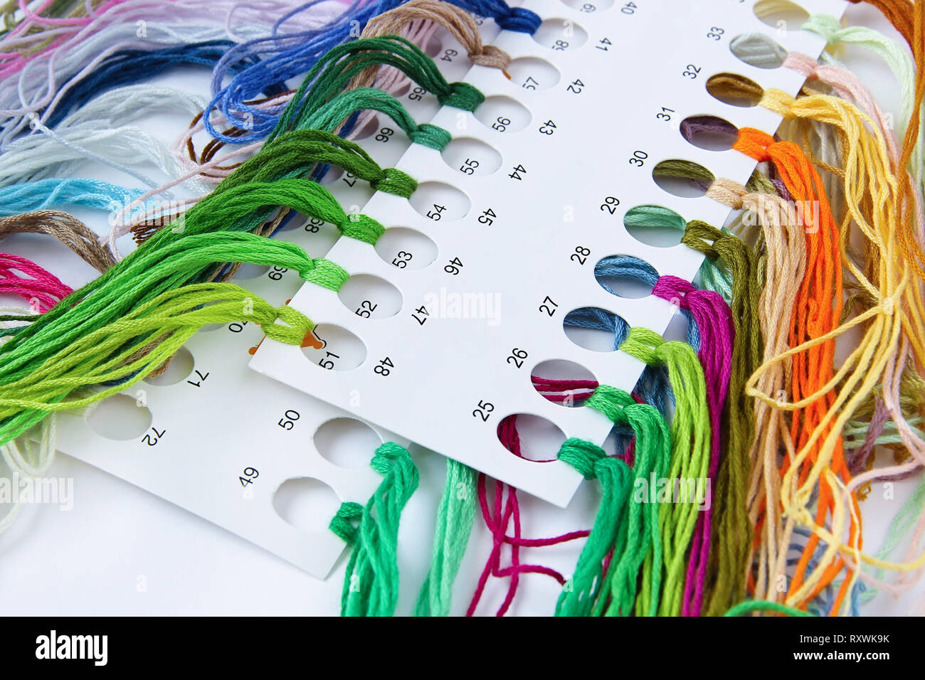 Numbered samples colored threads on pallets Stock Photo - Alamy
