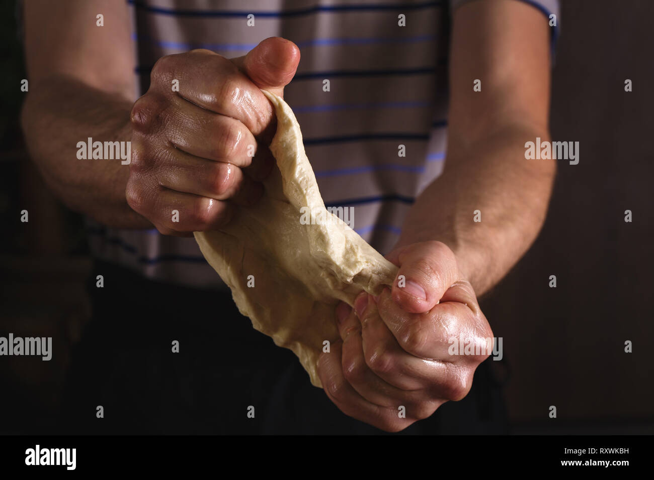 dough with his hands Stock Photo - Alamy