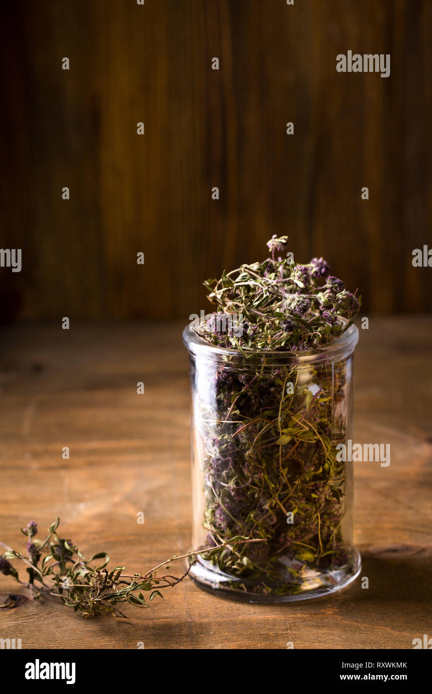Dry flowers of thyme in a glass jar Stock Photo - Alamy