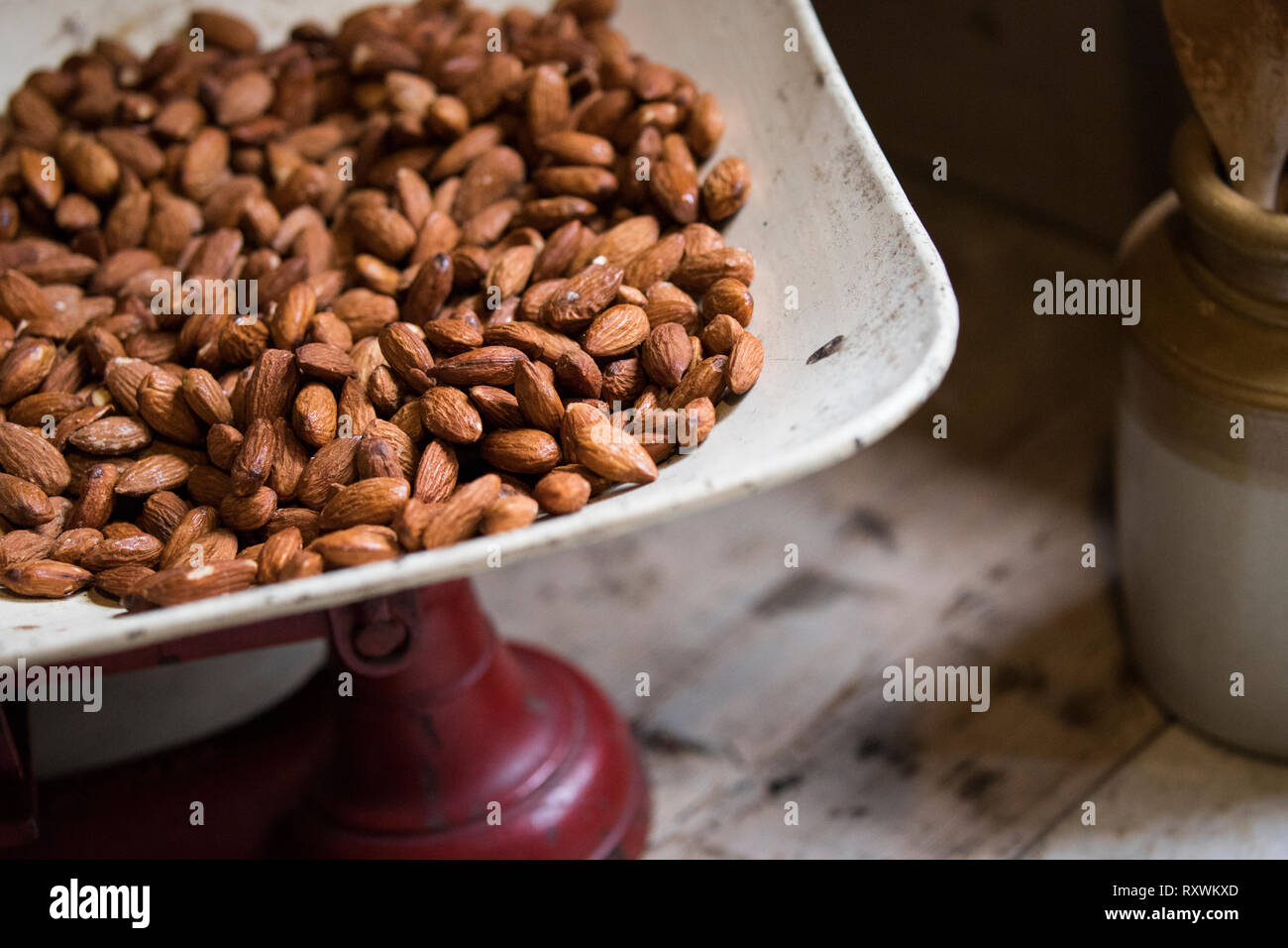 Almonds, weighed on a scale Stock Photo - Alamy