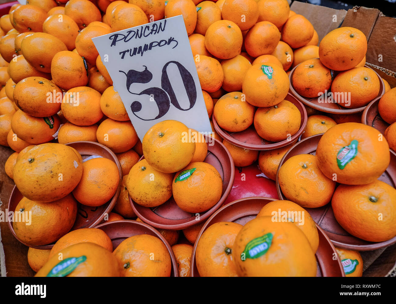 Manila, Philippines - Apr 12, 2017. Orange fruits for sale at the local ...