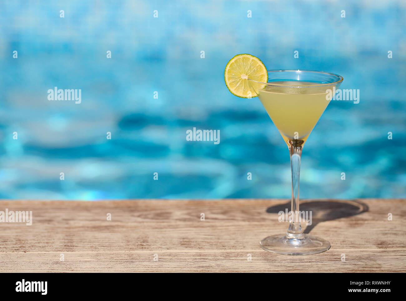 Daiquiri frozen cocktail with lime on the pool background Stock Photo ...
