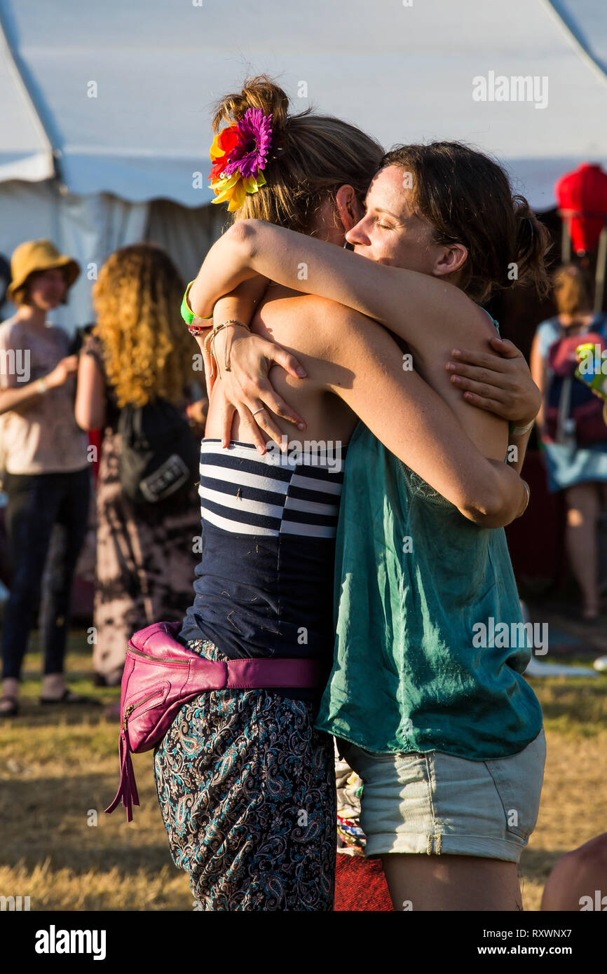 Two girls having a big hug at Into the Wild festival, Kent, UK Stock ...