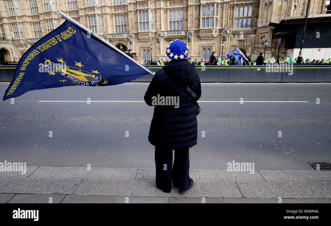 A Remain supporter stands with a banner across the street from the ...
