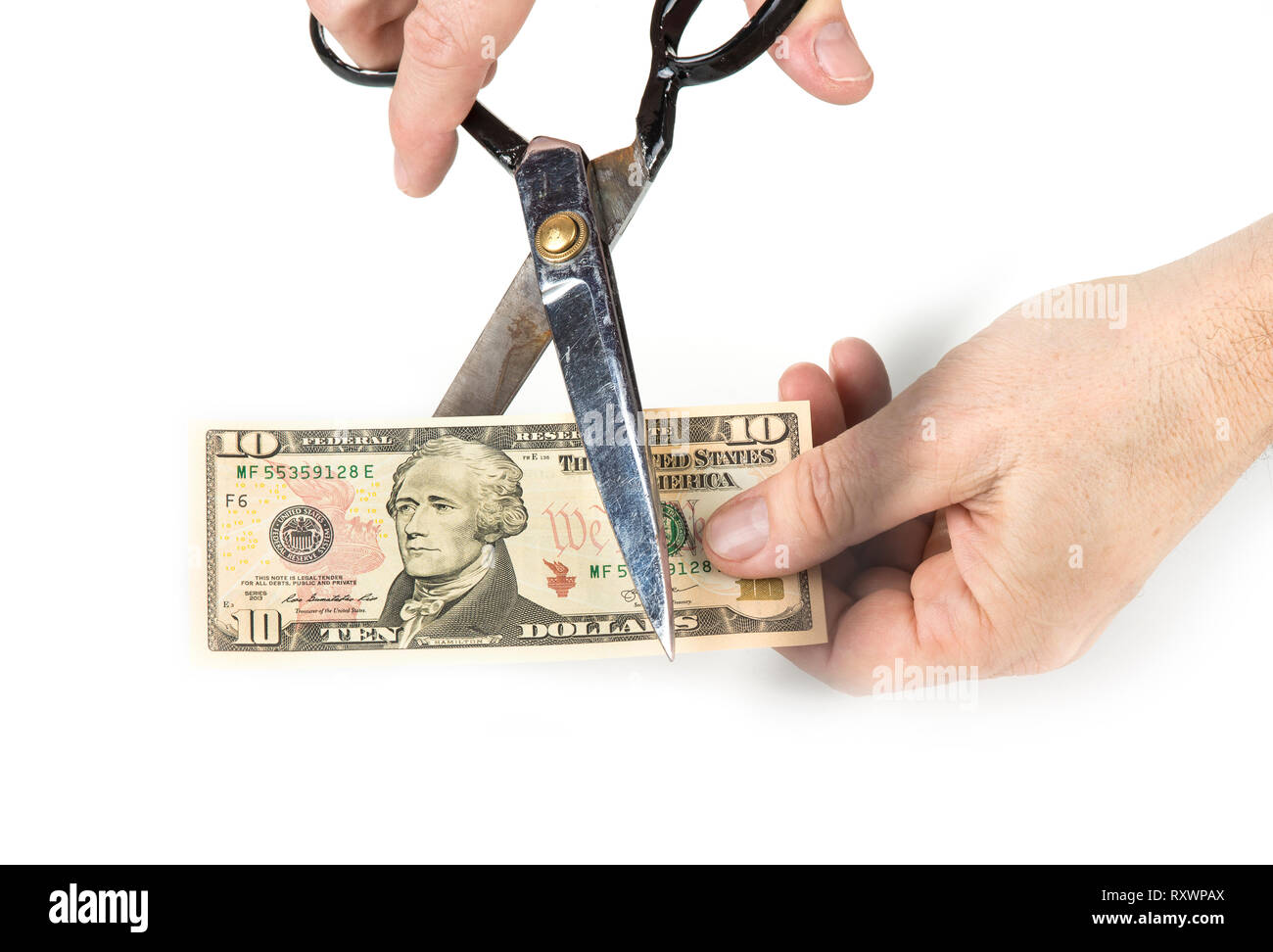 Paper money cut with scissors. Devaluation concept Stock Photo - Alamy