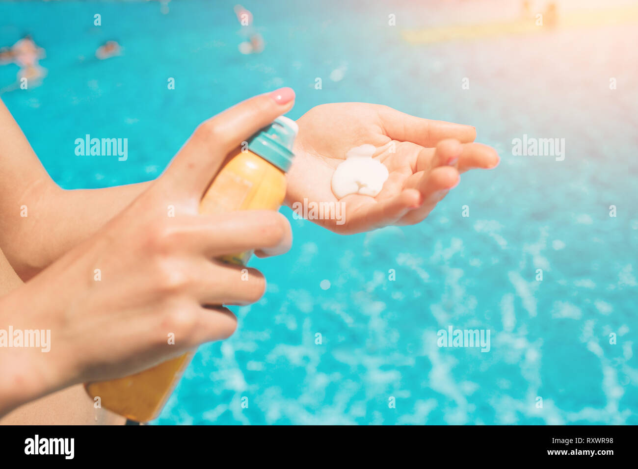 Putting on the sun lotion hi-res stock photography and images - Alamy