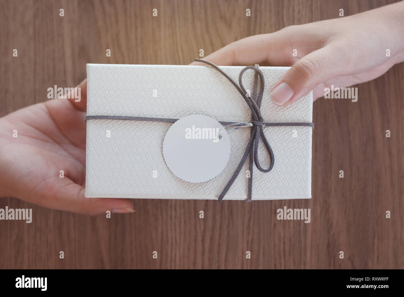 Child giving present to adult hi-res stock photography and images - Alamy