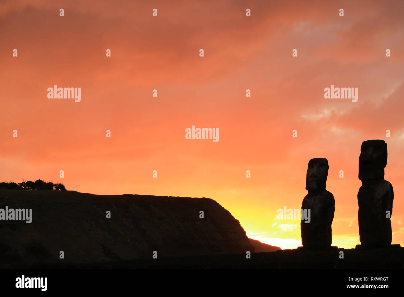 Silhouette of two of 15 huge Moai statues at Ahu Tongariki against ...
