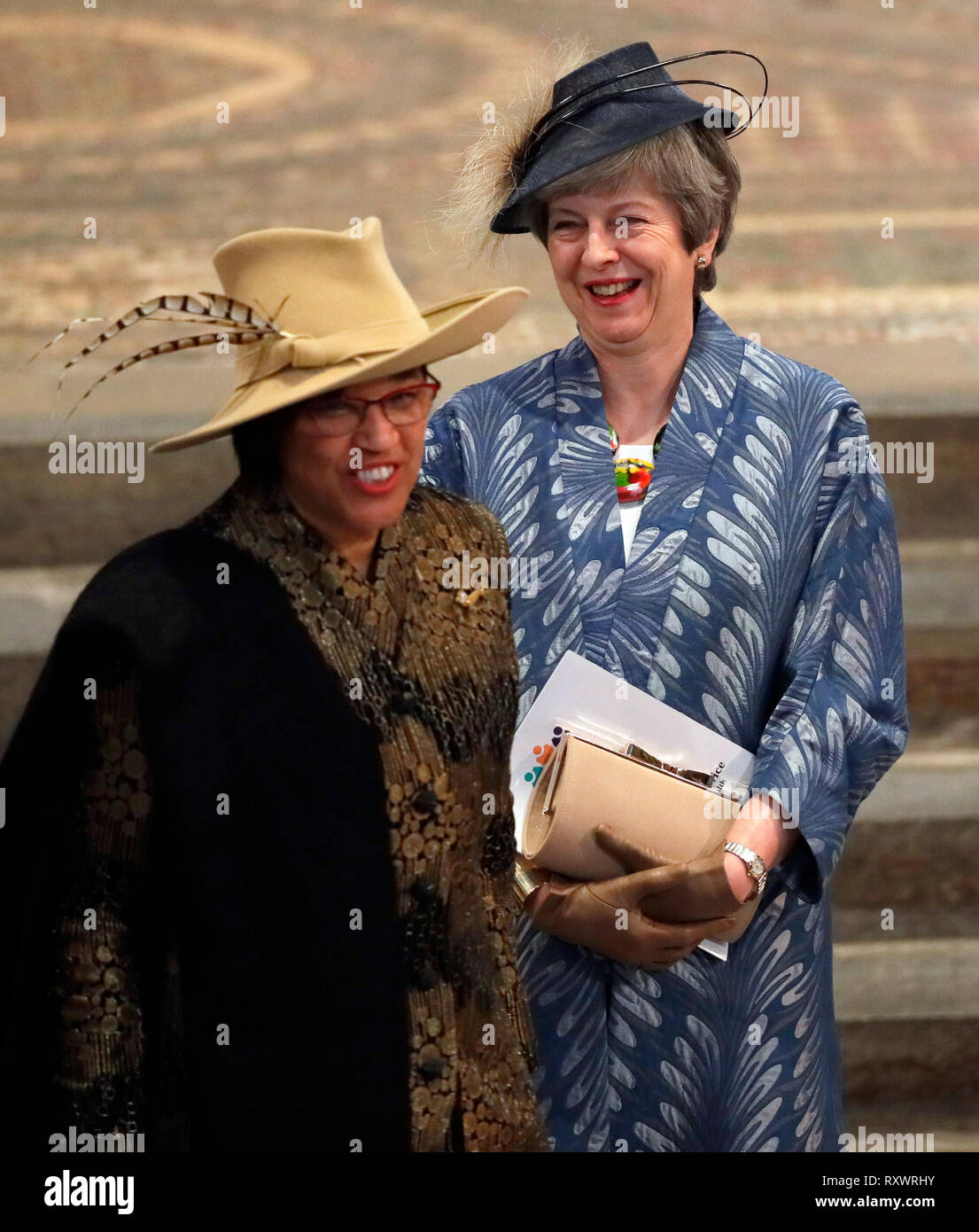 Prime Minister Theresa May (right) and Baroness Scotland laugh after ...