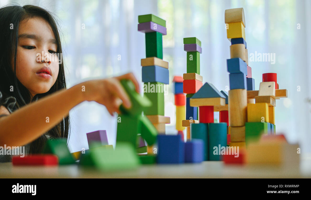 Kids building tower of blocks hi-res stock photography and images - Alamy