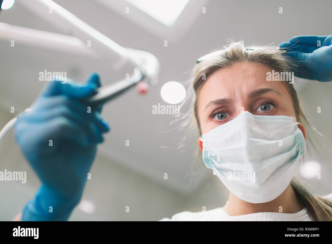 Portrait of female dentist . She examining a patient's teeth Stock ...