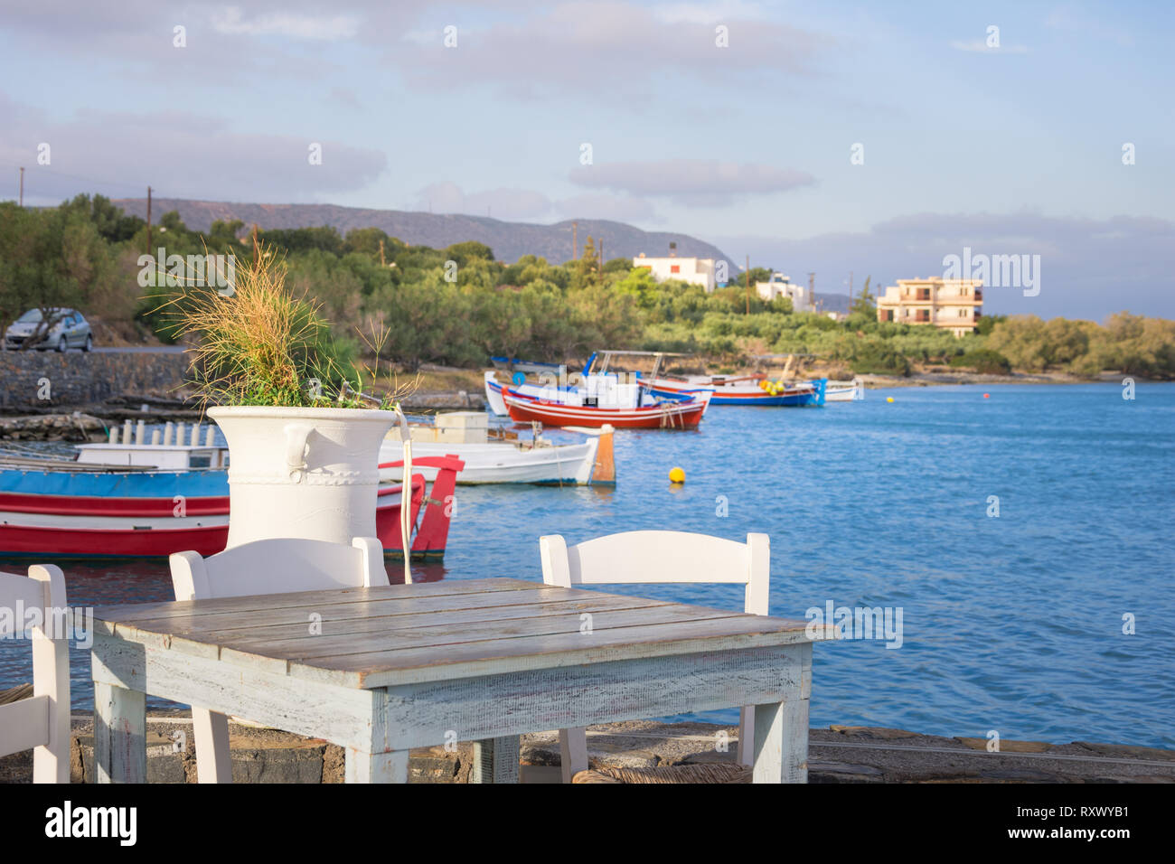 The small harbor of Plaka with traditional fishing boatsnear Elounda ...