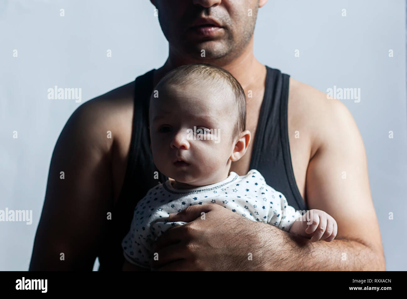 Adorable father and child. A brutal view of father and newborn kid baby ...