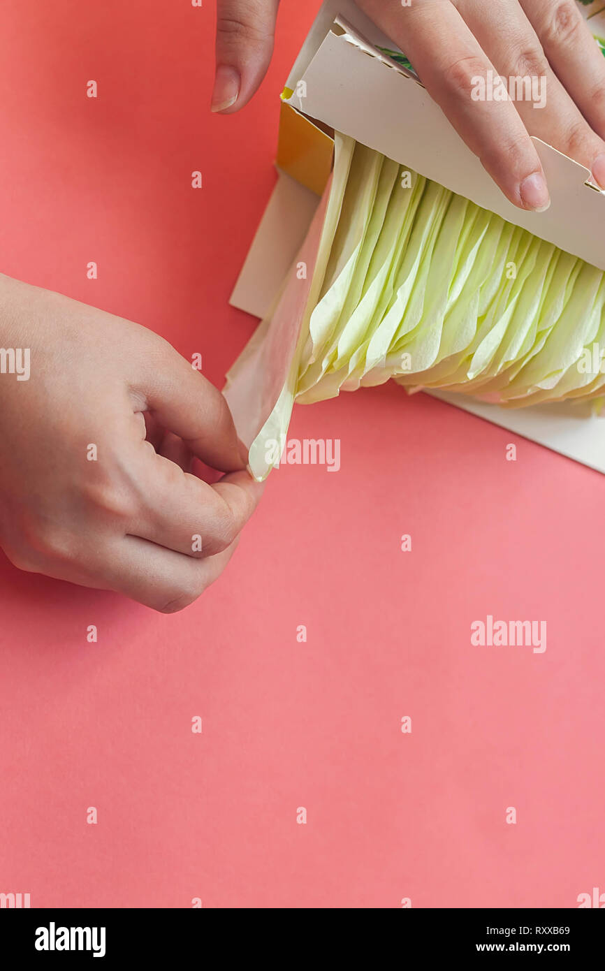 Young girl taking the menstrual pad out of the box. Menstruation ...