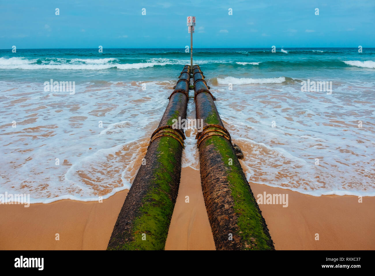 Pipe leading into the Ocean Stock Photo - Alamy