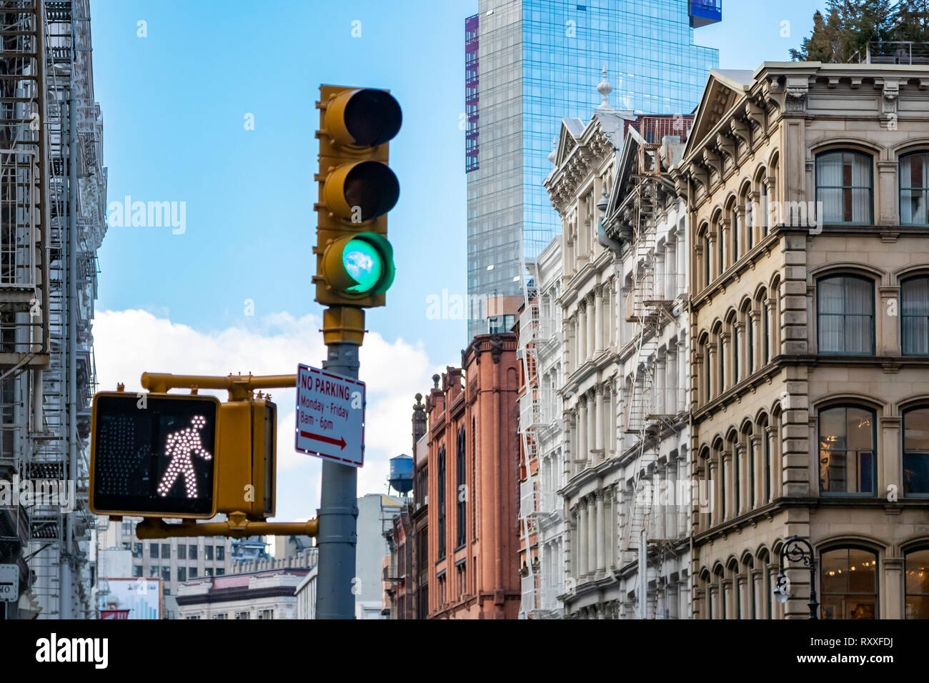 Traffic light and old buildings at an intersection on Broome Street in ...