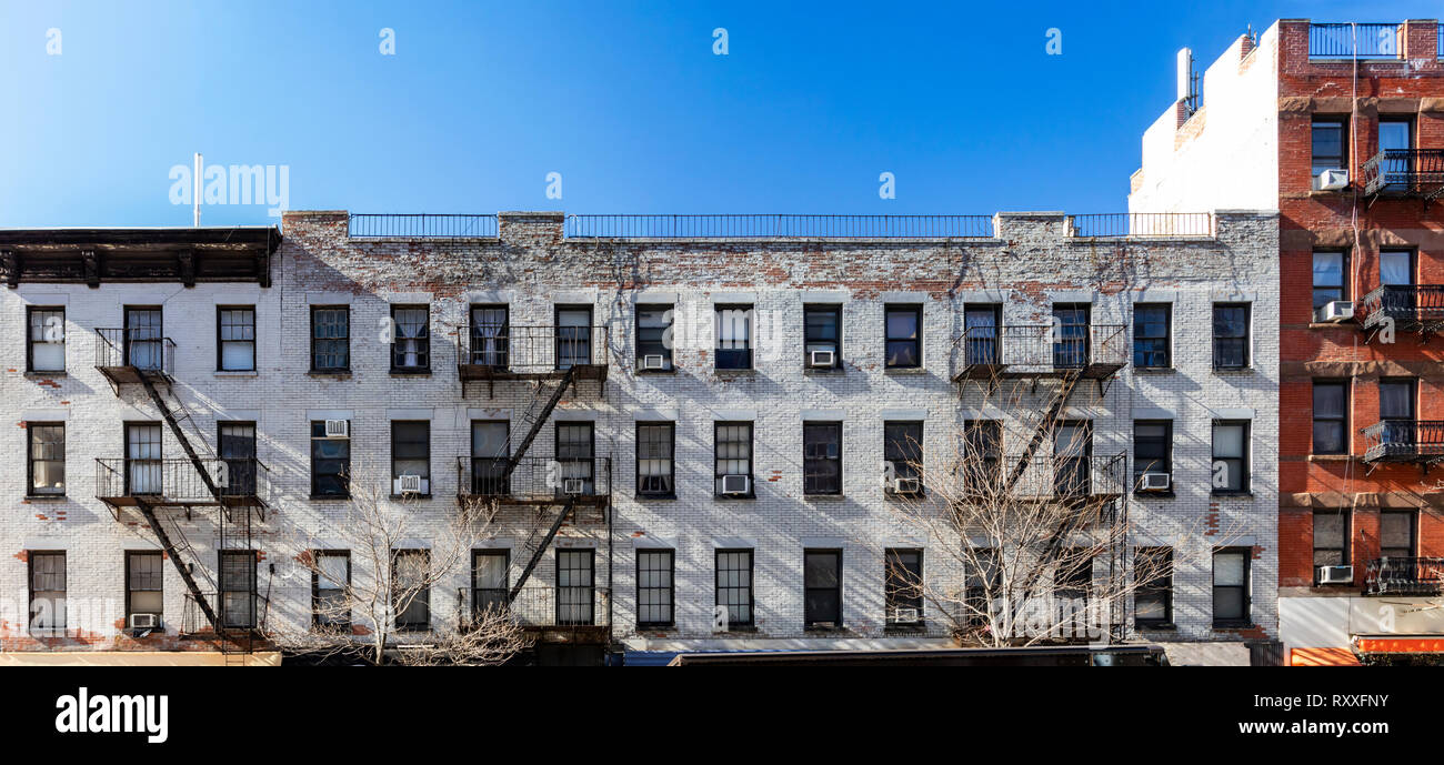 Exterior view of the facade of an old brick apartment buildings with ...