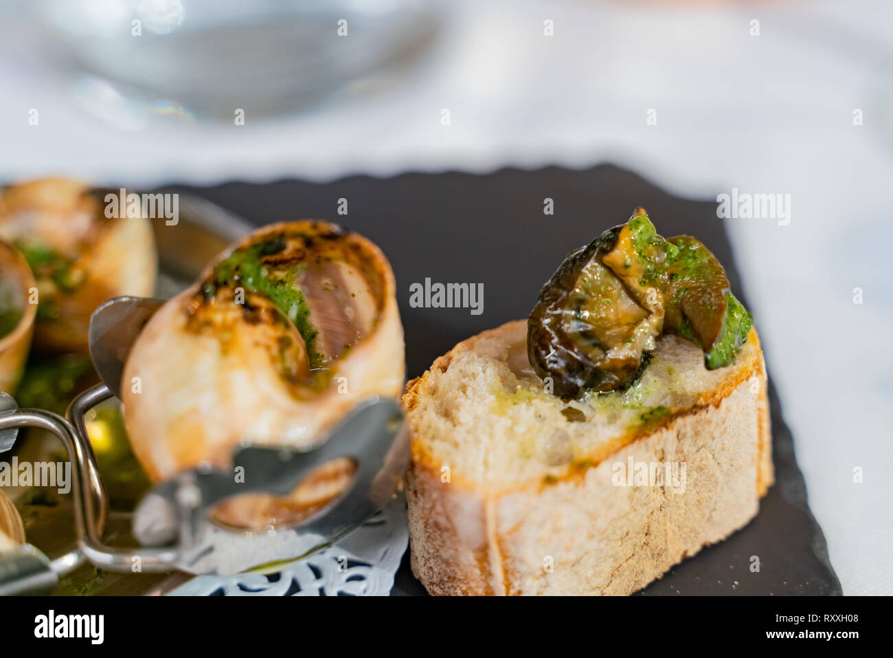 Close up of a dish of grill snails, ate at Nice, France Stock Photo - Alamy