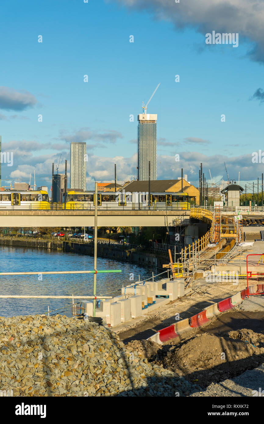 Metrolink tram crossing the river Irwell at Pomona, with the new ...