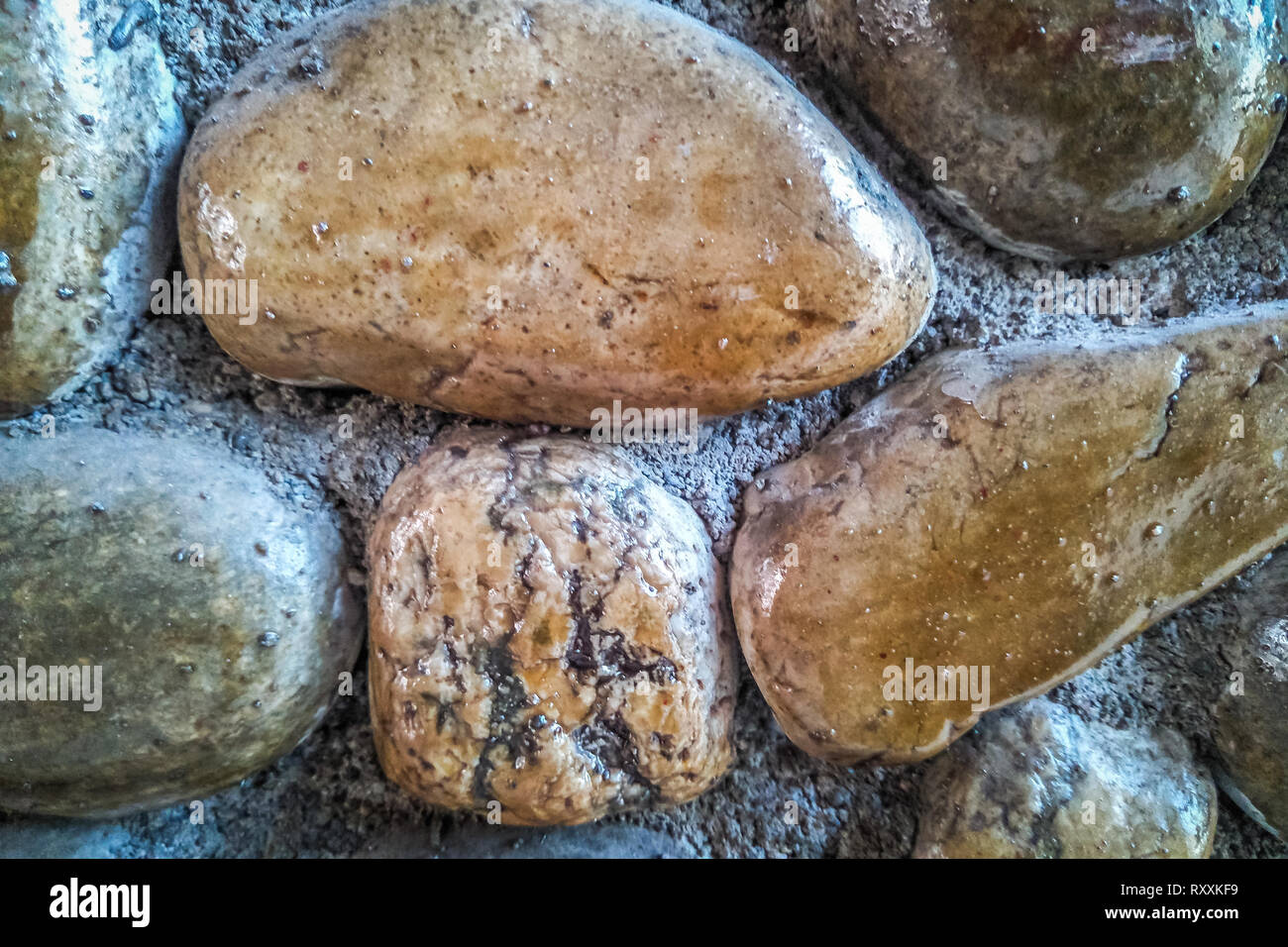 Stone wall rounded stones hi-res stock photography and images - Alamy