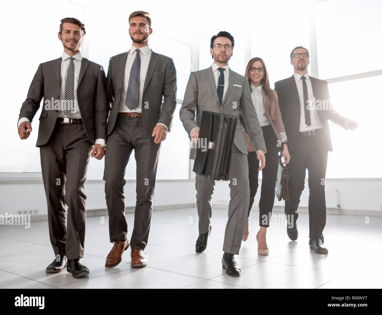 Business people walking down a hallway hi-res stock photography and ...
