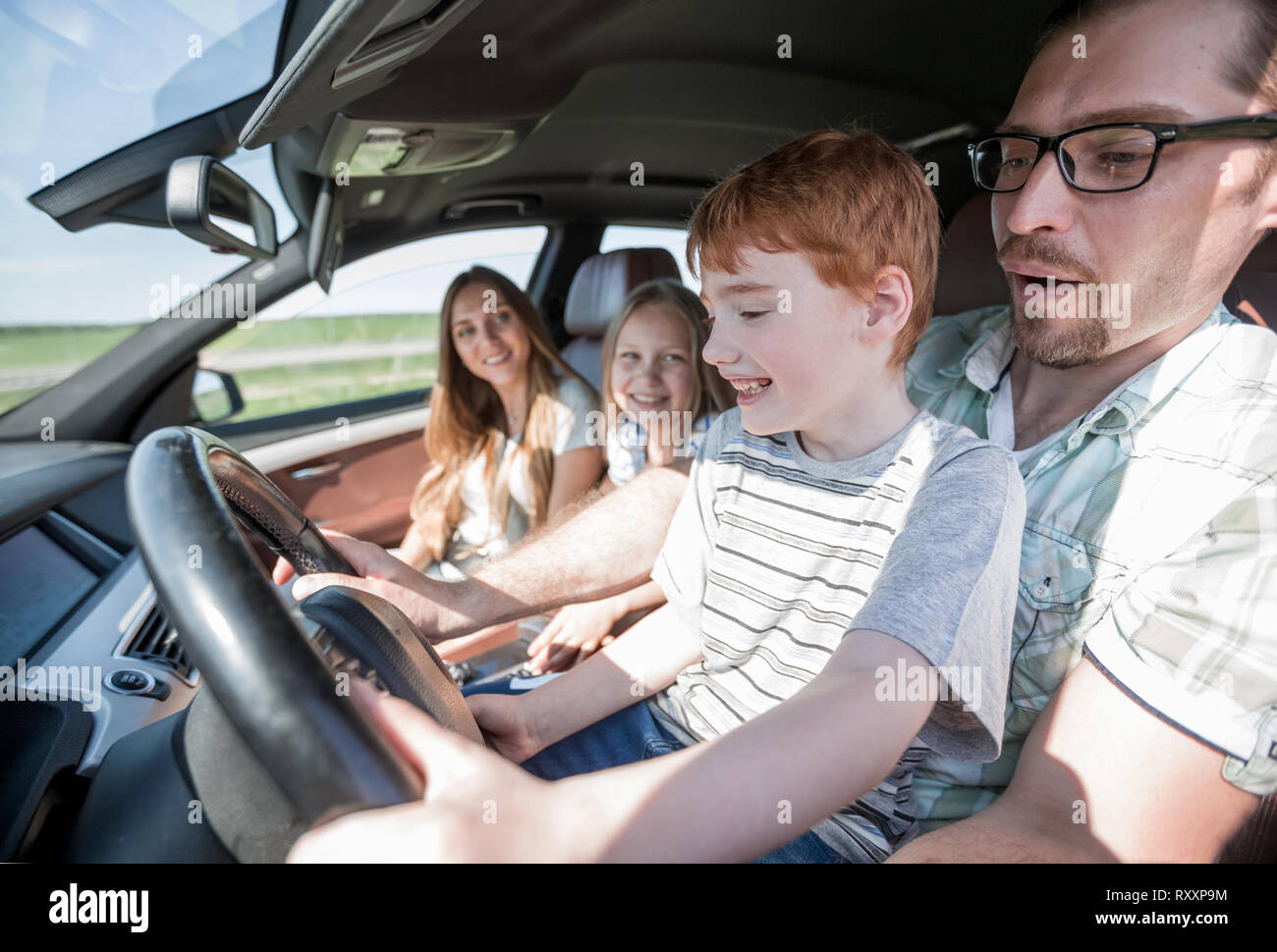 funny father and his little son driving a car Stock Photo - Alamy