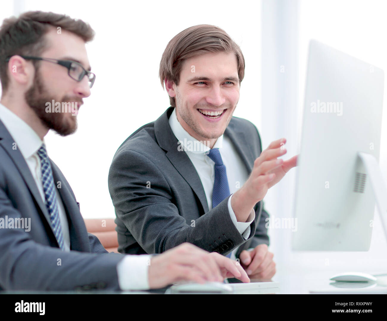 colleagues are discussing new data, sitting at a Desk Stock Photo - Alamy