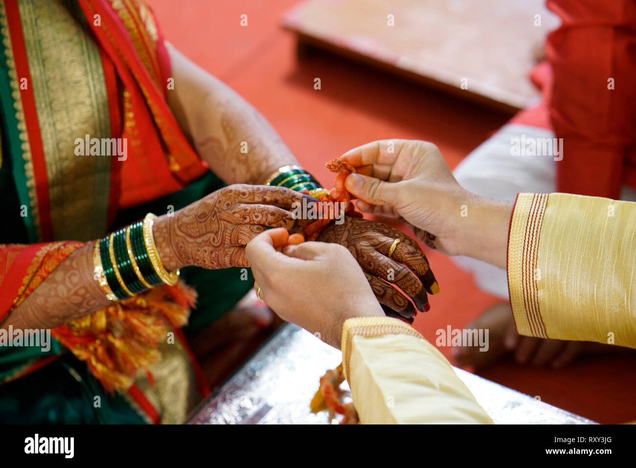 Traditional Hindu marriage ceremony where groom tides holy thread on ...