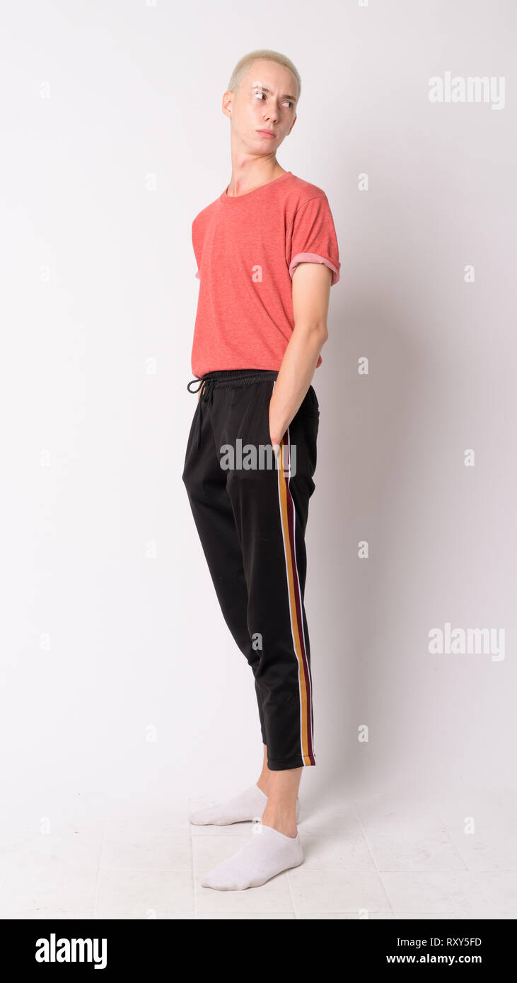 Full body shot of young handsome androgynous man looking back Stock ...